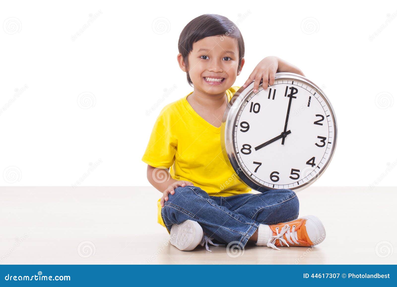 Cute boy holding clock stock image. Image of human, male - 44617307