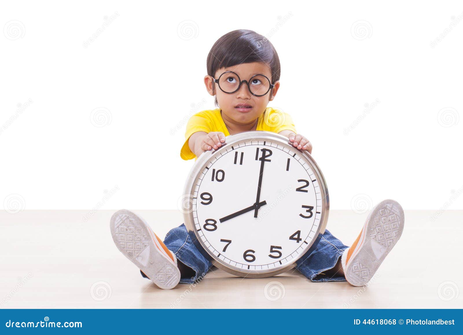 Cute boy holding clock stock photo. Image of child, education - 44618068