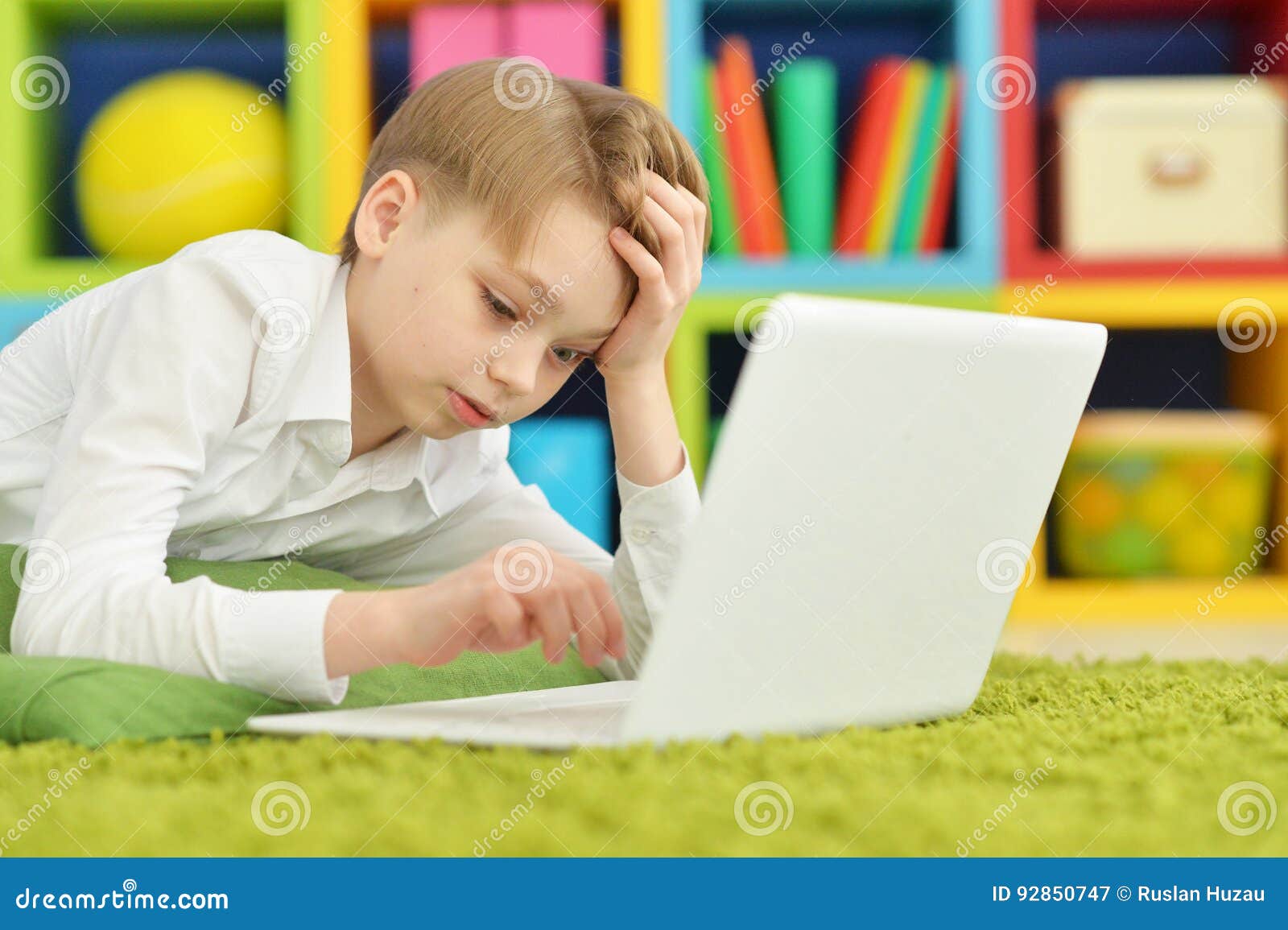 Cute boy with a laptop stock image. Image of study, modern - 92850747