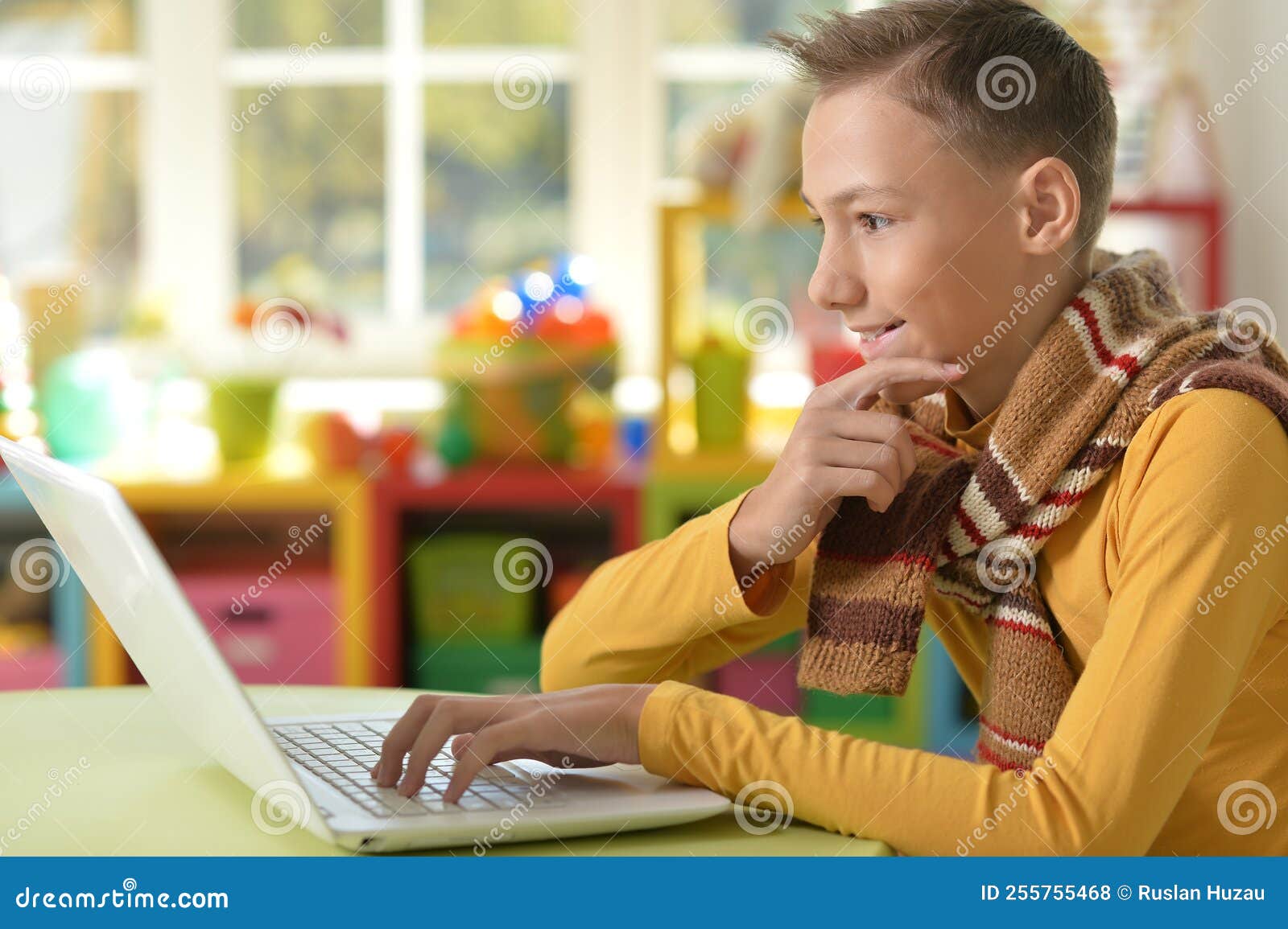 Cute Boy with Laptop at the Table Stock Photo - Image of earphones ...
