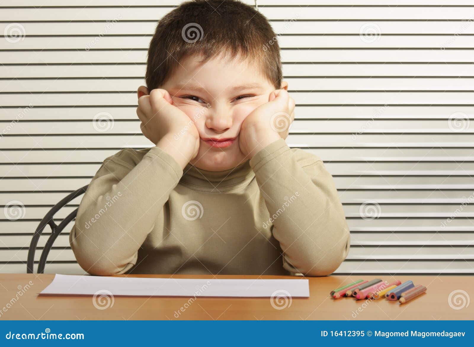 Cute boy leaning on hands stock image. Image of little - 16412395