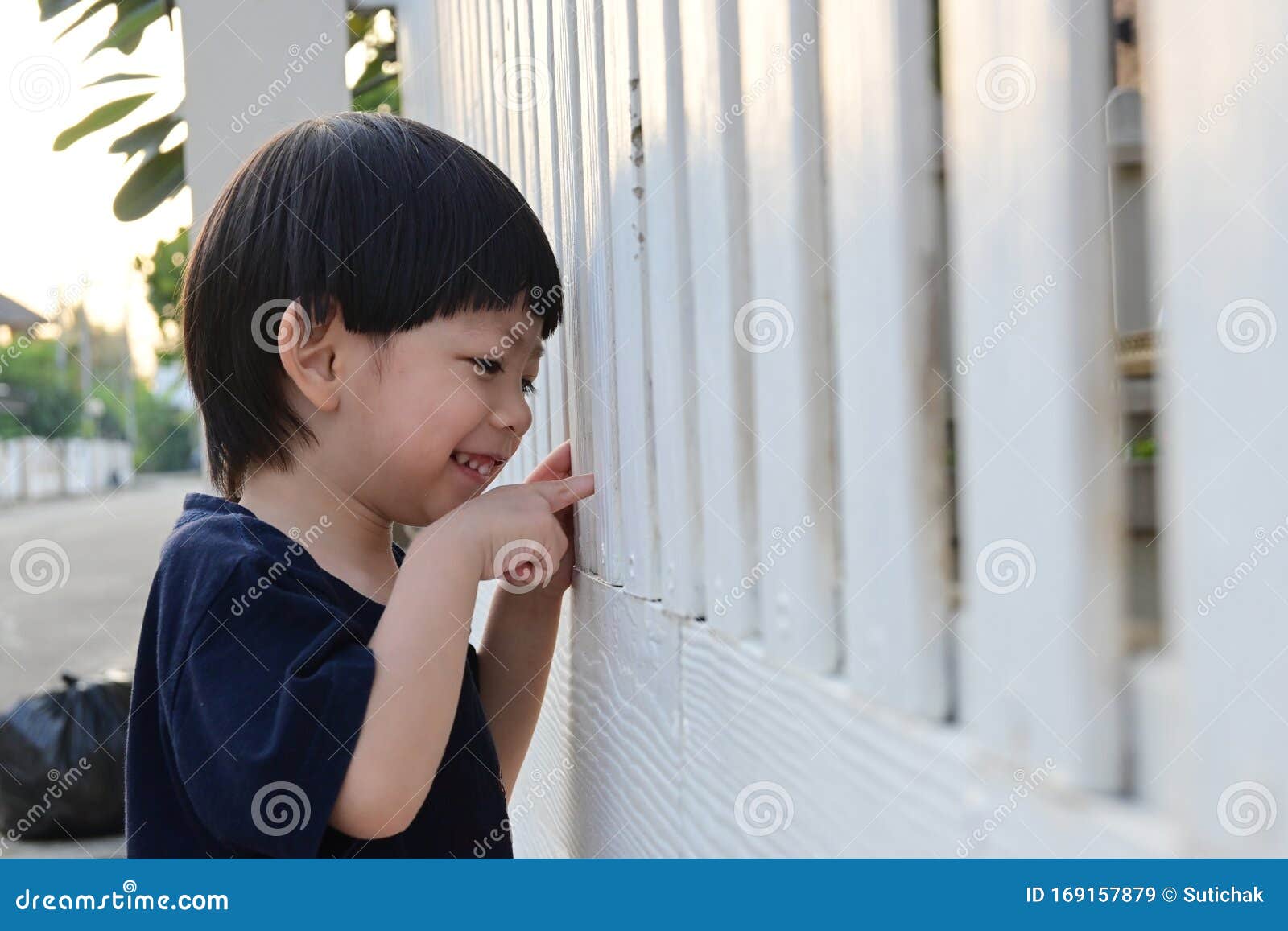 Cute Boy Looking through White Wooden Front Gate Stock Image - Image of ...