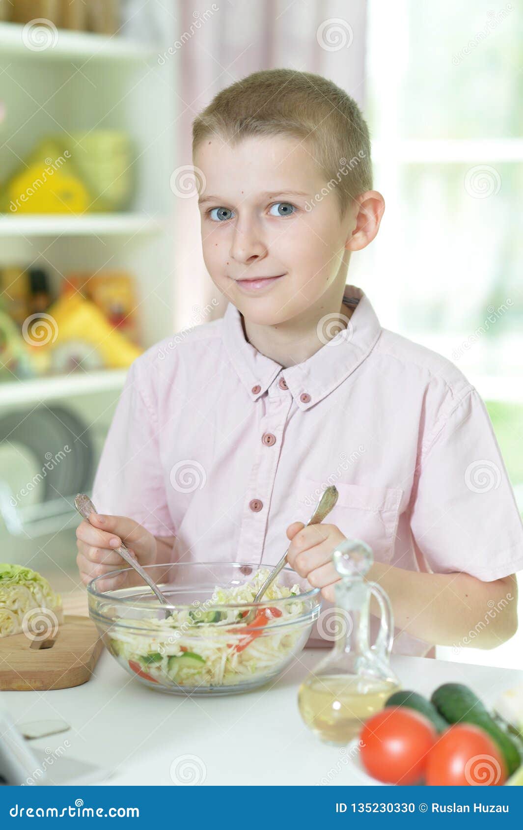 Cute Boy Making Dinner on Kitchen Table at Home Stock Photo - Image of ...