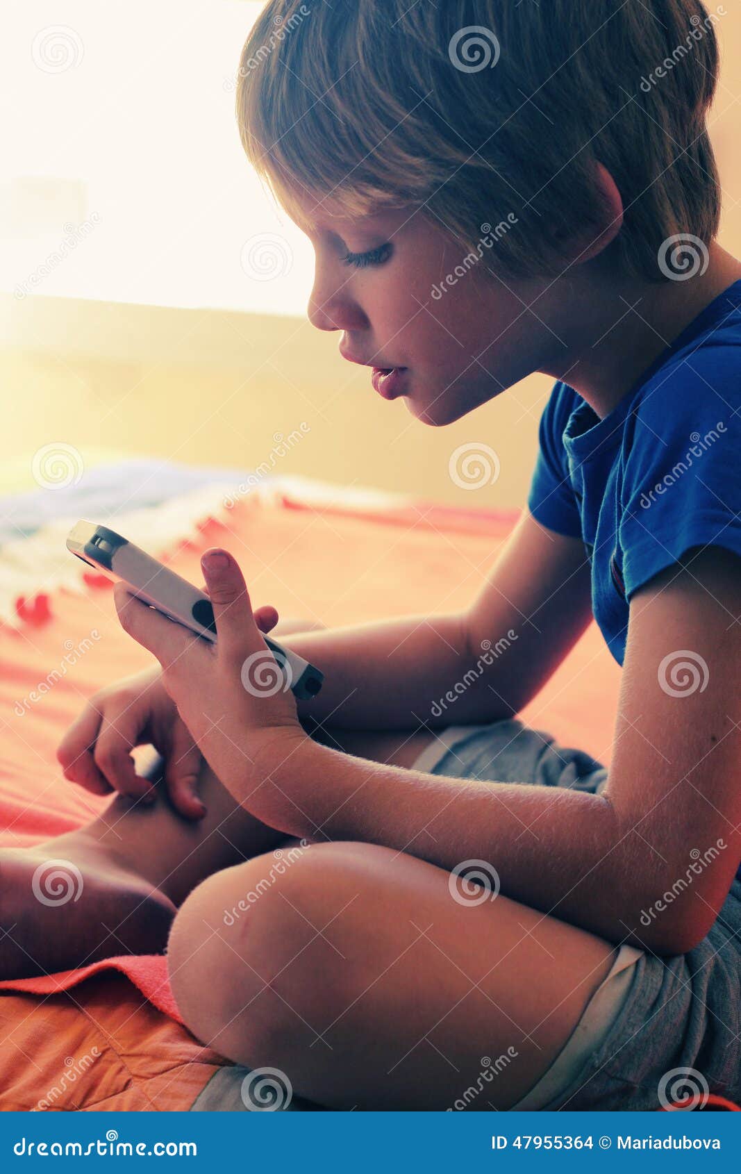 Cute boy with mobile phone stock photo. Image of play - 47955364