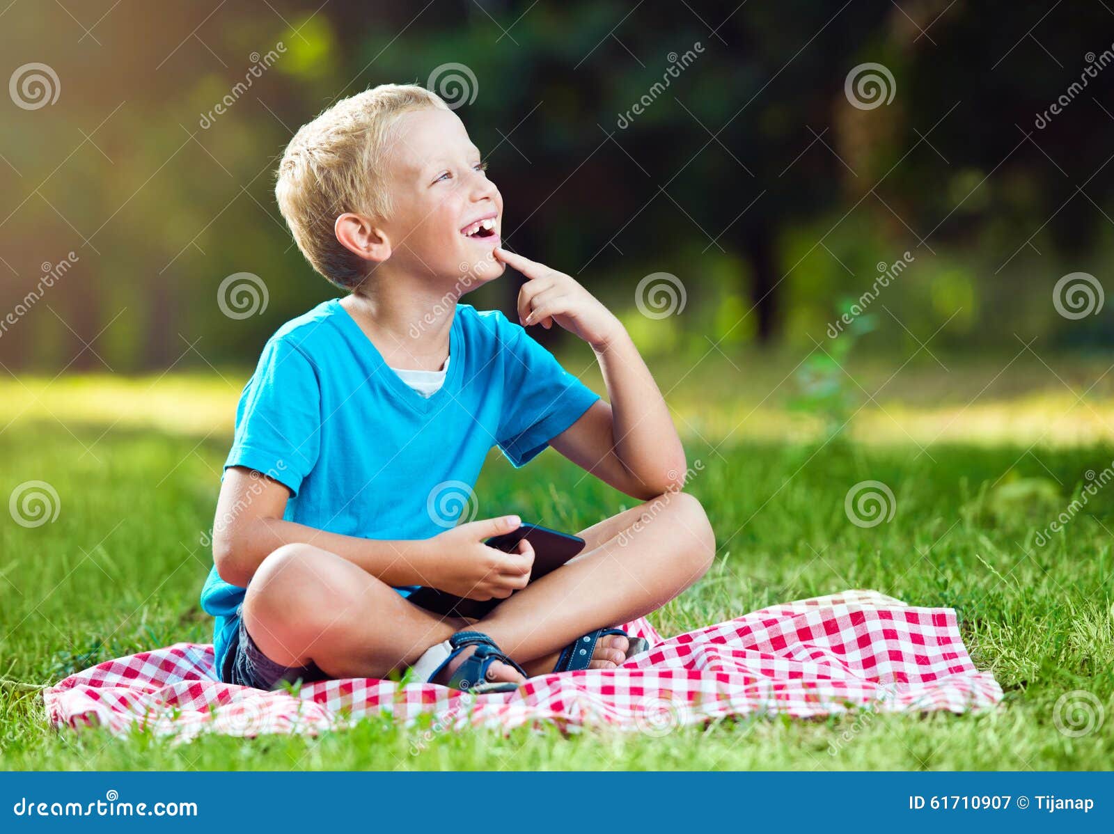 Cute Boy in a Park Thinking Stock Image - Image of caucasian, lying ...