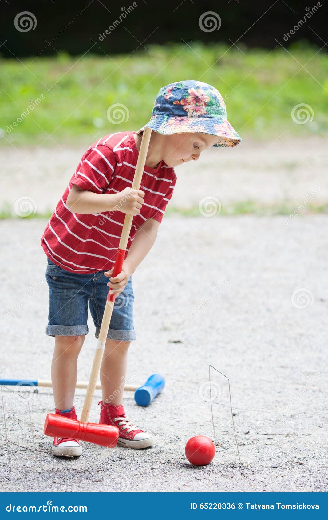 Cute boy, playing croquet stock photo. Image of colors - 65220336