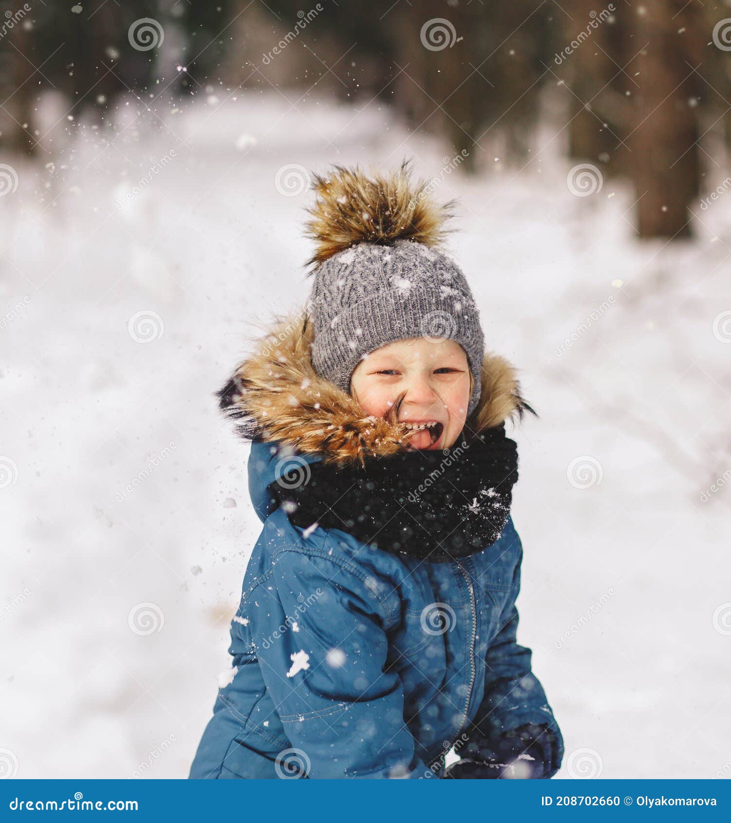 Cute Boy Plays with Snow in a Beautiful Snow Park in Winter Stock Photo ...