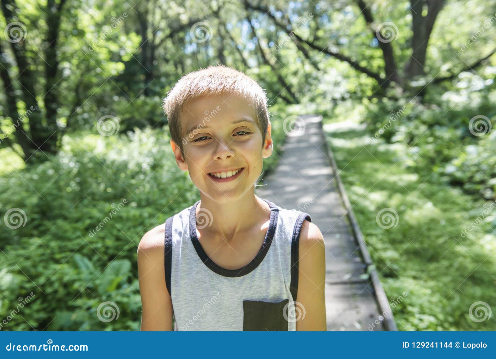 A Cute Boy Portrait in the Forest Stock Photo - Image of children ...