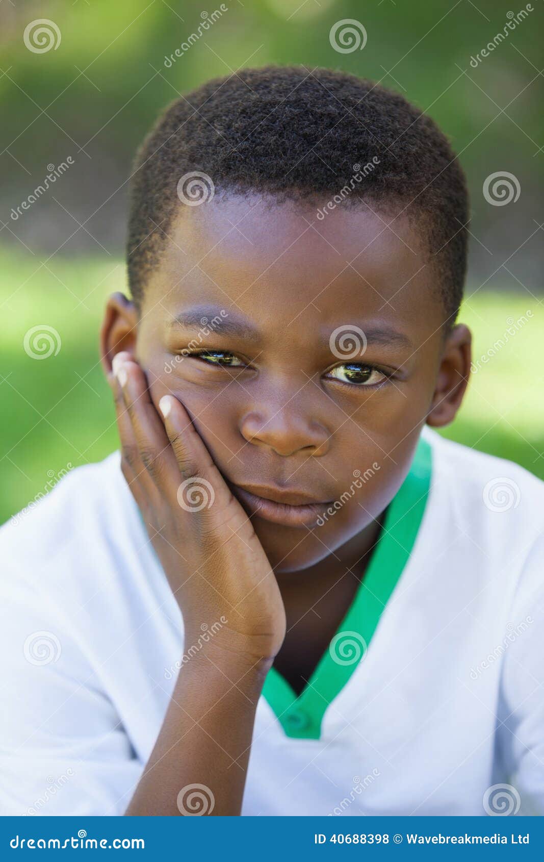 Cute Boy Pouting at the Camera in the Park Stock Photo - Image of park ...