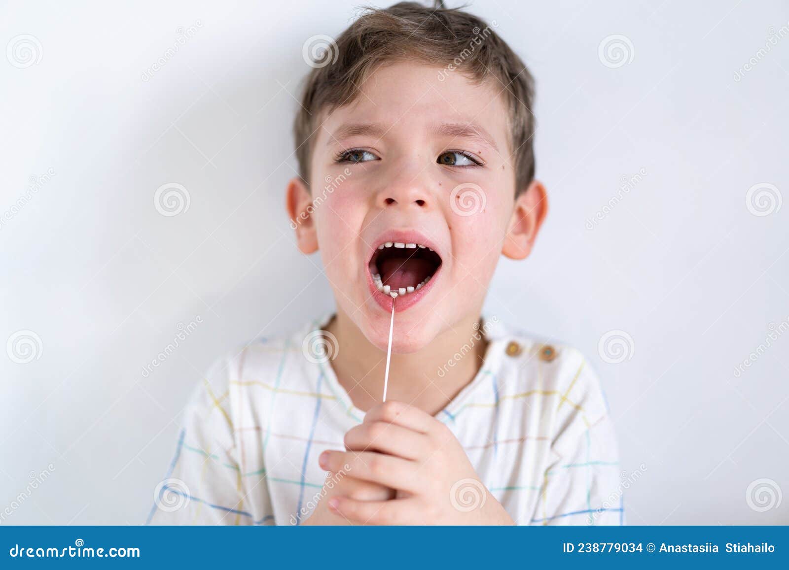 Cute Boy Pulling Loose Tooth Using a Dental Floss. Process of Removing ...