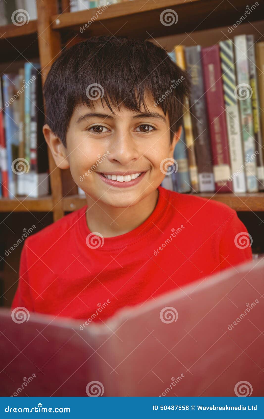 Cute Boy Reading Book in Library Stock Photo - Image of portrait ...