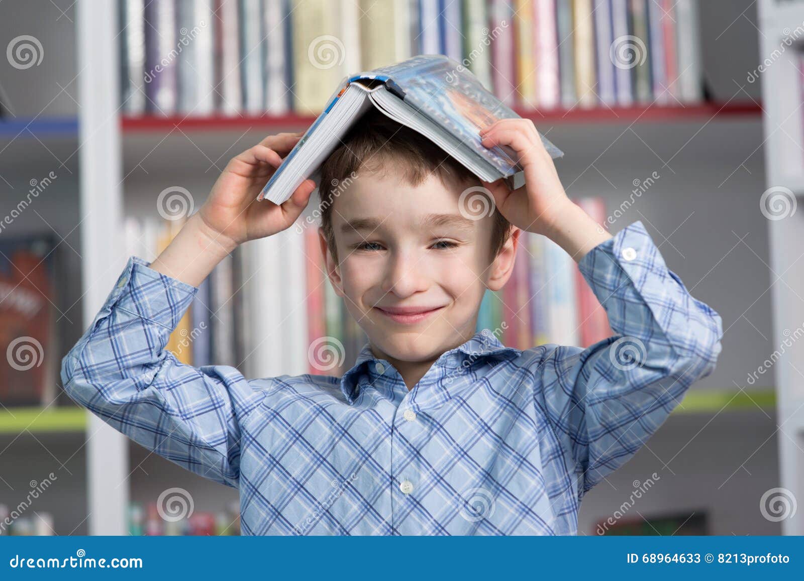 Cute Boy Reading Book in Library Stock Image - Image of child, learning ...