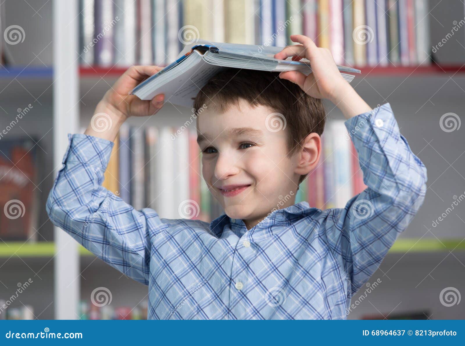 Cute Boy Reading Book in Library Stock Image - Image of library ...