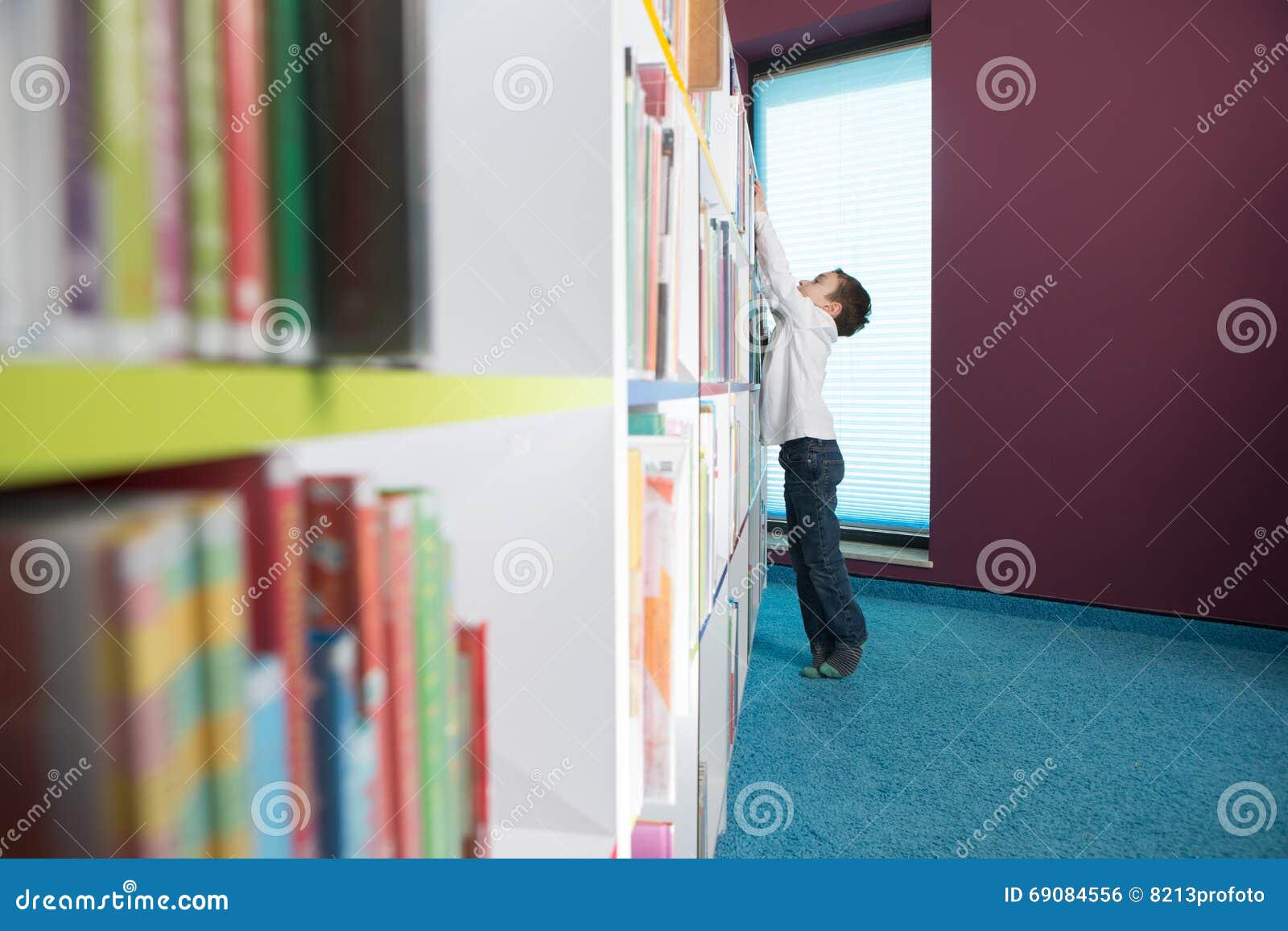 Cute Boy Reading Book in Library Stock Photo - Image of learning ...