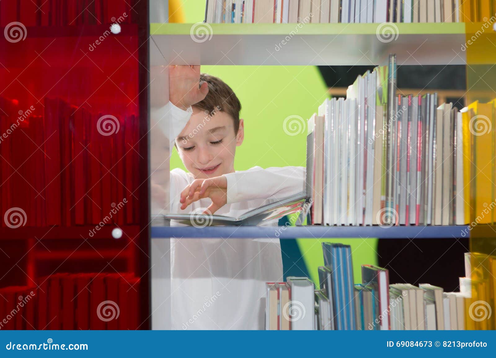 Cute Boy Reading Book in Library Stock Image - Image of caucasian ...