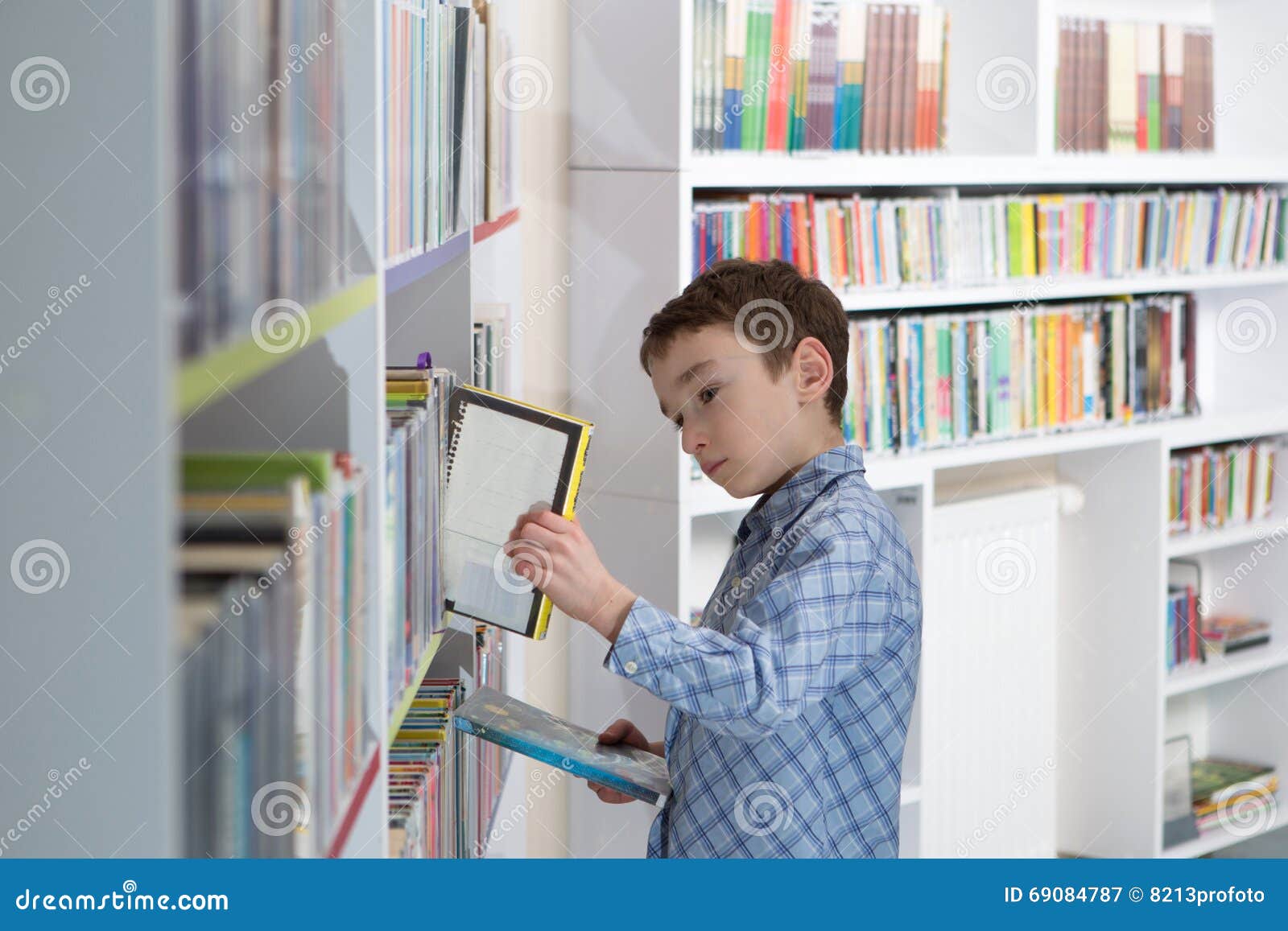 Cute Boy Reading Book in Library Stock Image - Image of computer ...