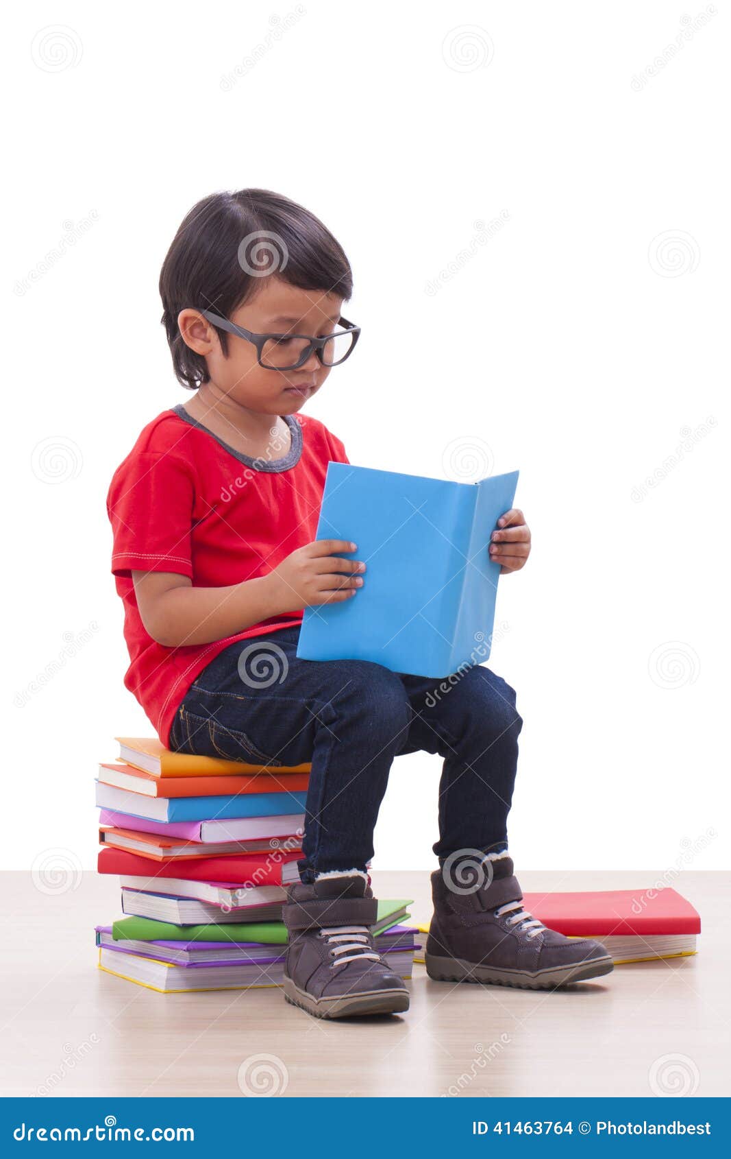 Cute boy reading a book stock photo. Image of asian, creative - 41463764