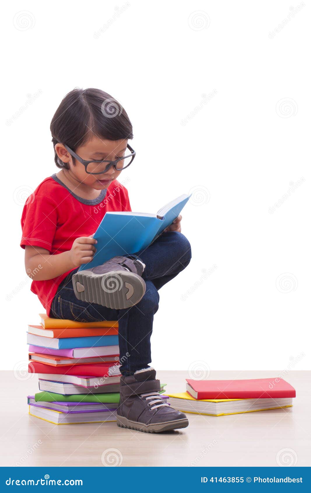 Cute boy reading a book stock image. Image of heap, lesson - 41463855
