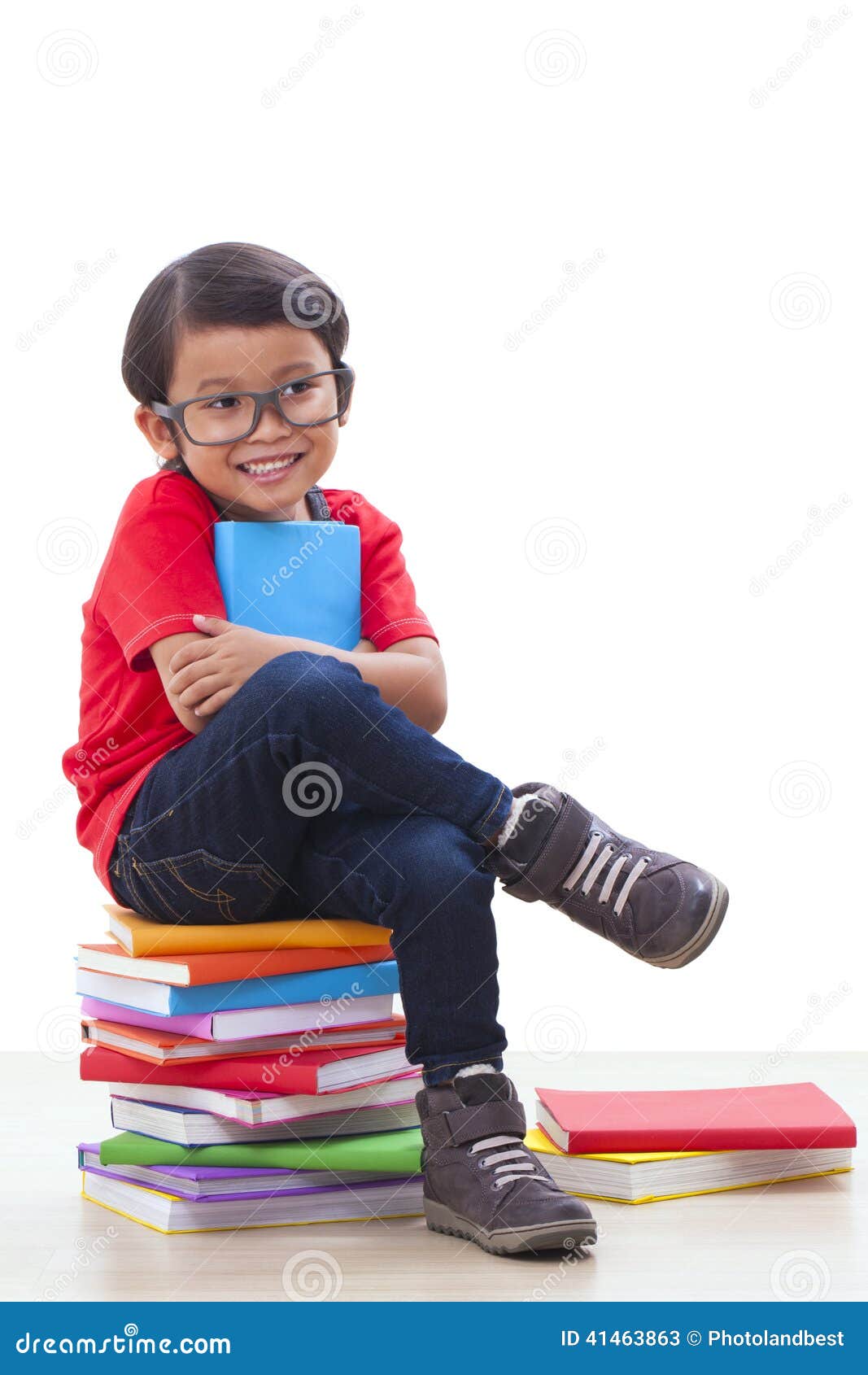 Cute boy reading a book stock image. Image of library - 41463863
