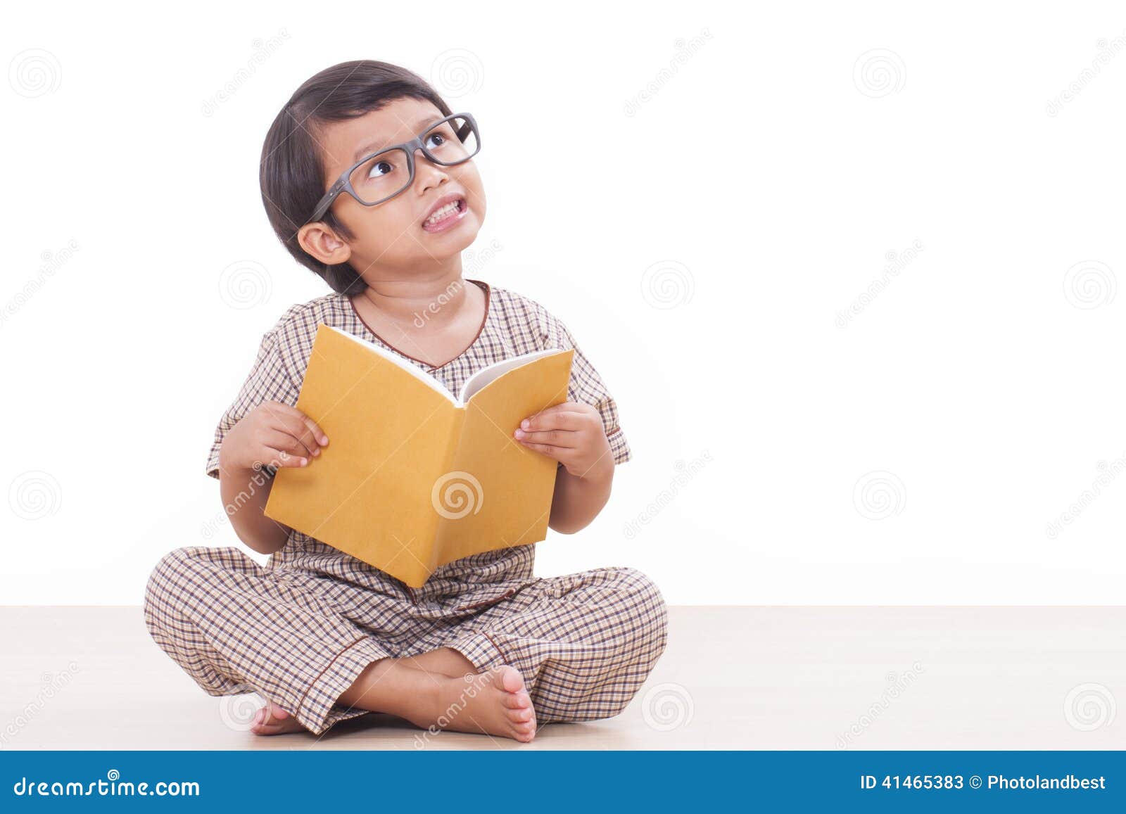 Cute boy is reading a book stock image. Image of closeup - 41465383