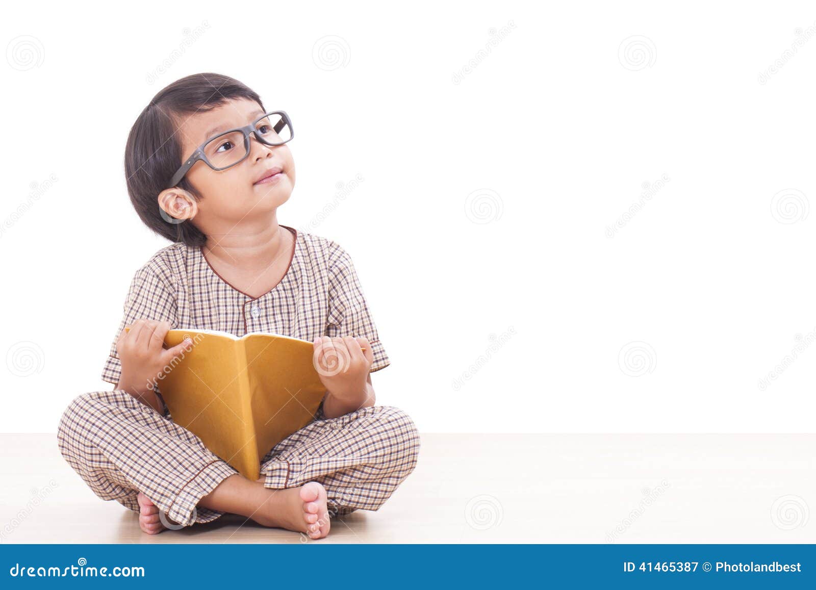 Cute boy is reading a book stock image. Image of education - 41465387