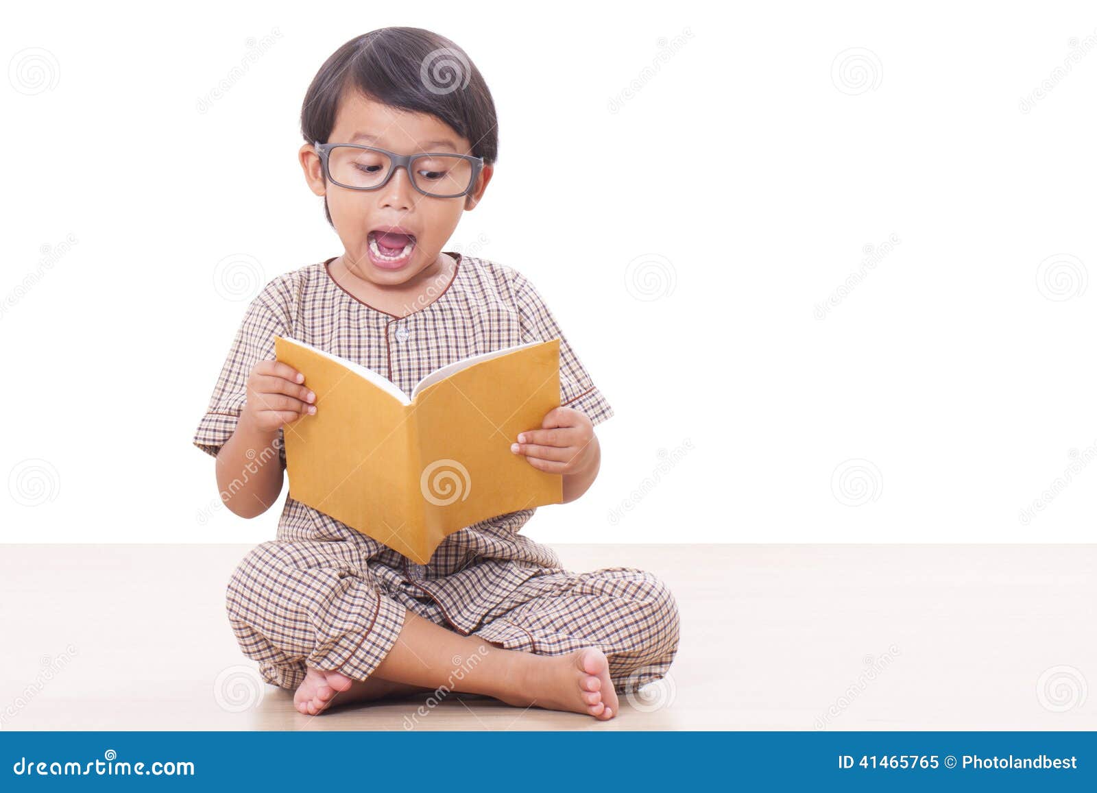 Cute boy is reading a book stock image. Image of indoors - 41465765