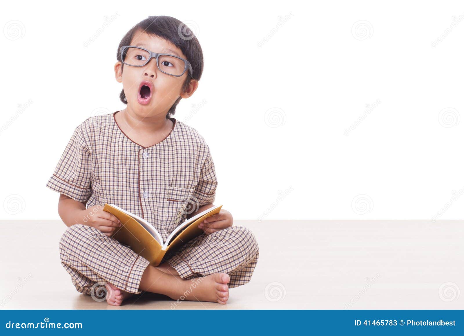 Cute boy is reading a book stock image. Image of elementary - 41465783