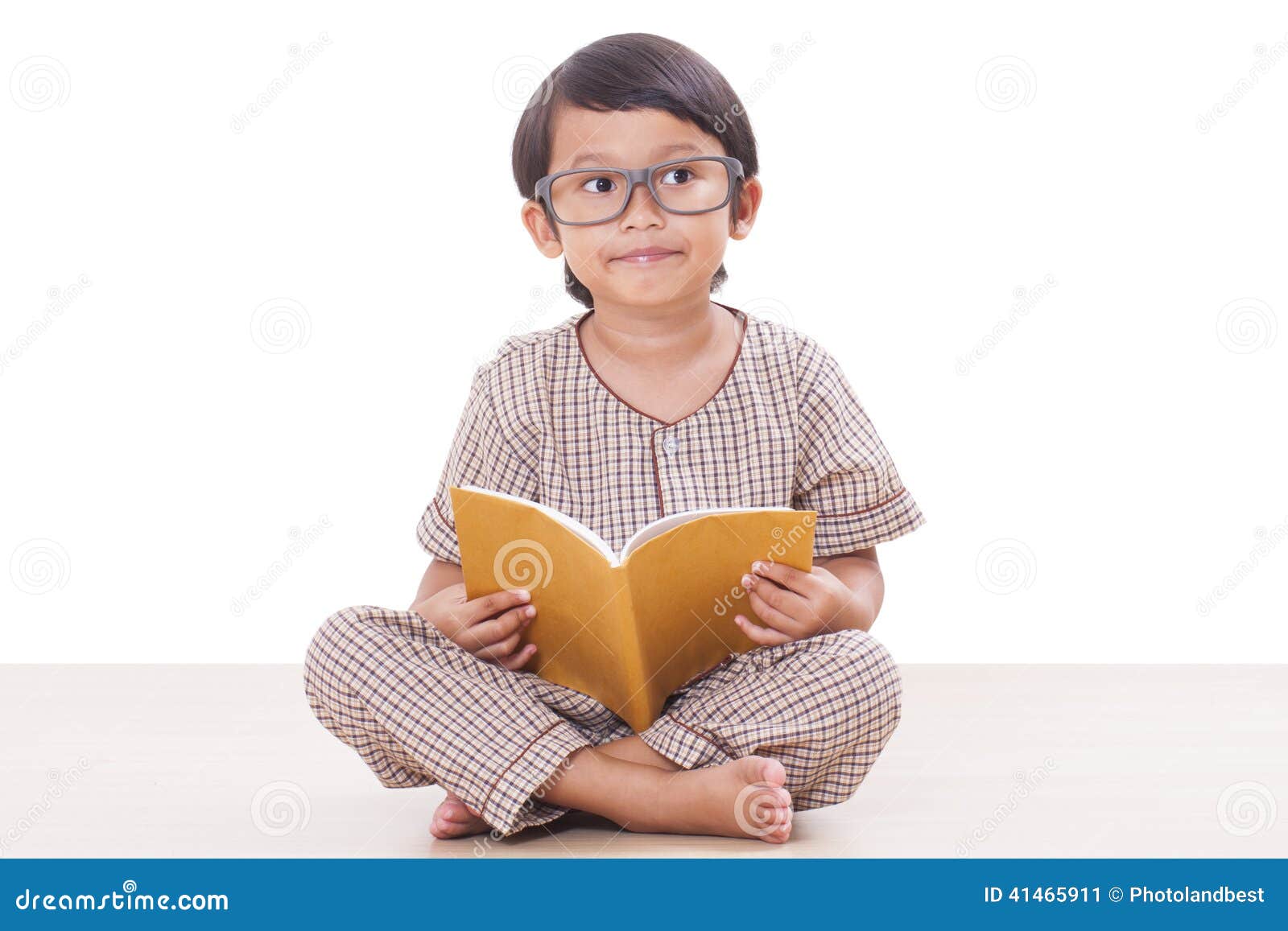 Cute boy is reading a book stock image. Image of eyeglasses - 41465911