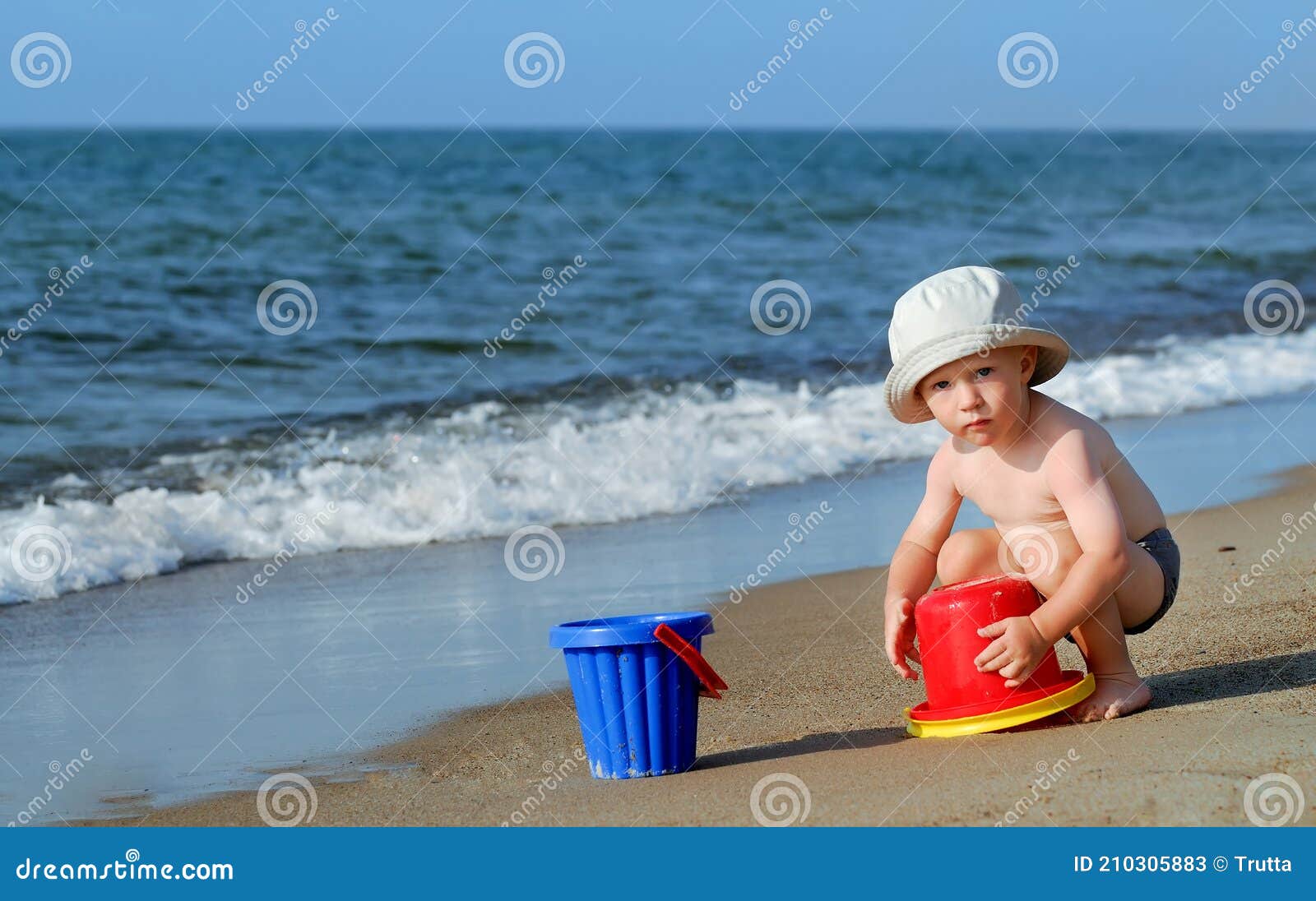 Little Boy Playing on the Beach Stock Image - Image of blond, person ...
