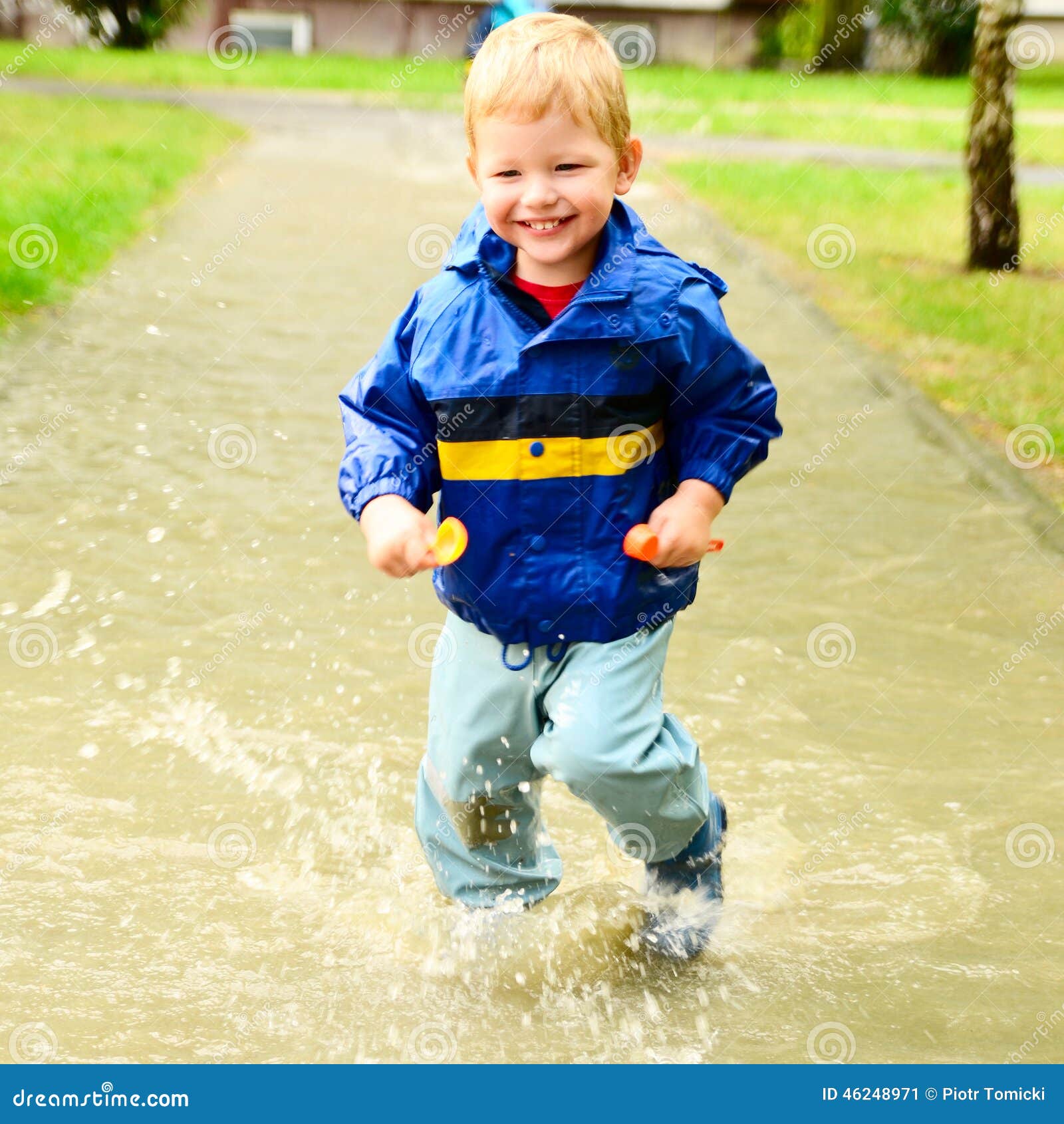 Cute Boy Running through Puddle after the Rain Stock Image - Image of ...