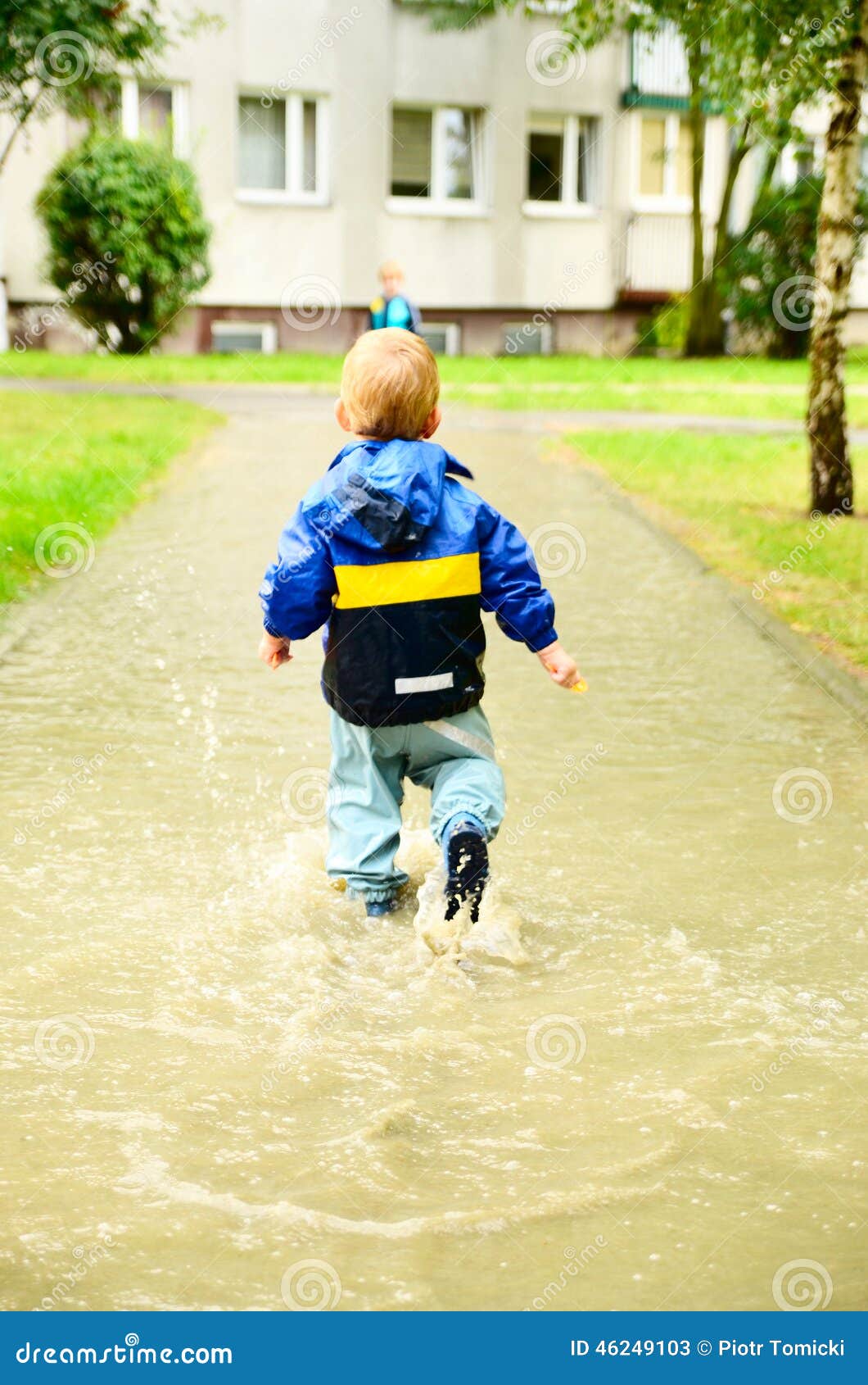 Cute Boy Running through Puddle after the Rain Stock Image - Image of ...
