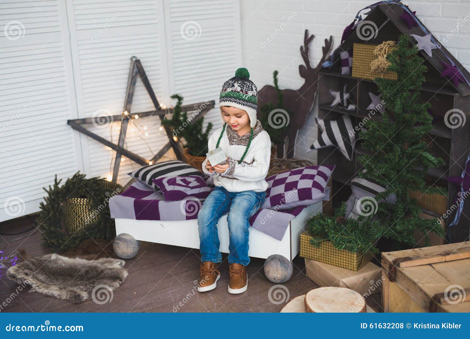 Cute Boy Sits in a Decorated Studio Stock Photo - Image of denim ...