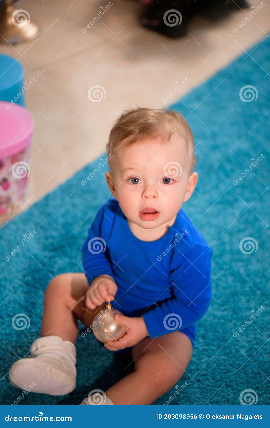 Cute Boy Sitting on the Carpet Near Christmas Tree Stock Photo - Image ...