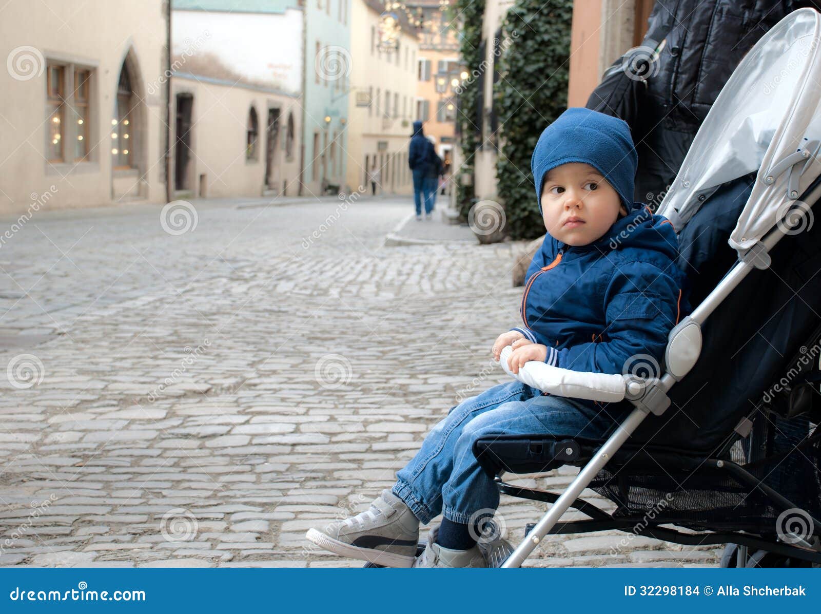 Cute Boy Sitting in Stroller Stock Photo - Image of comfortable, baby ...