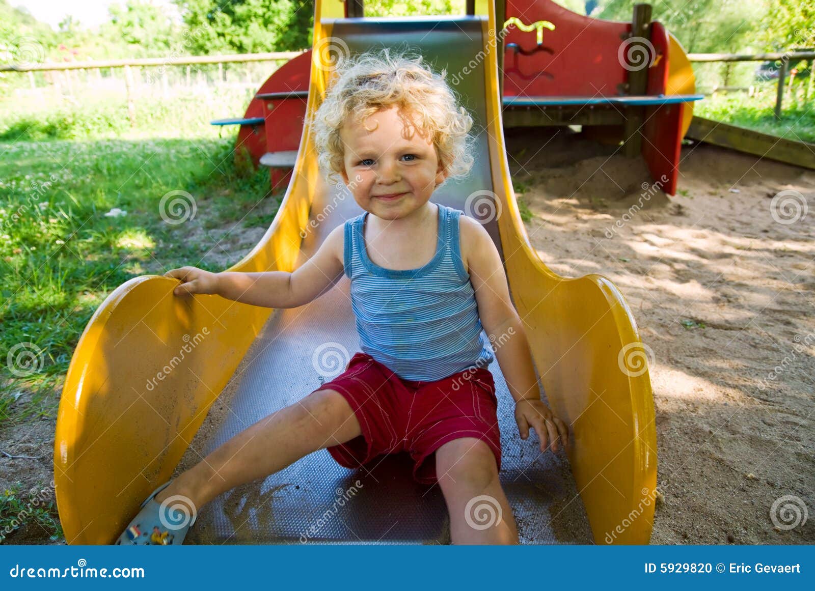 Cute boy on a slide stock photo. Image of lifestyle, outside - 5929820