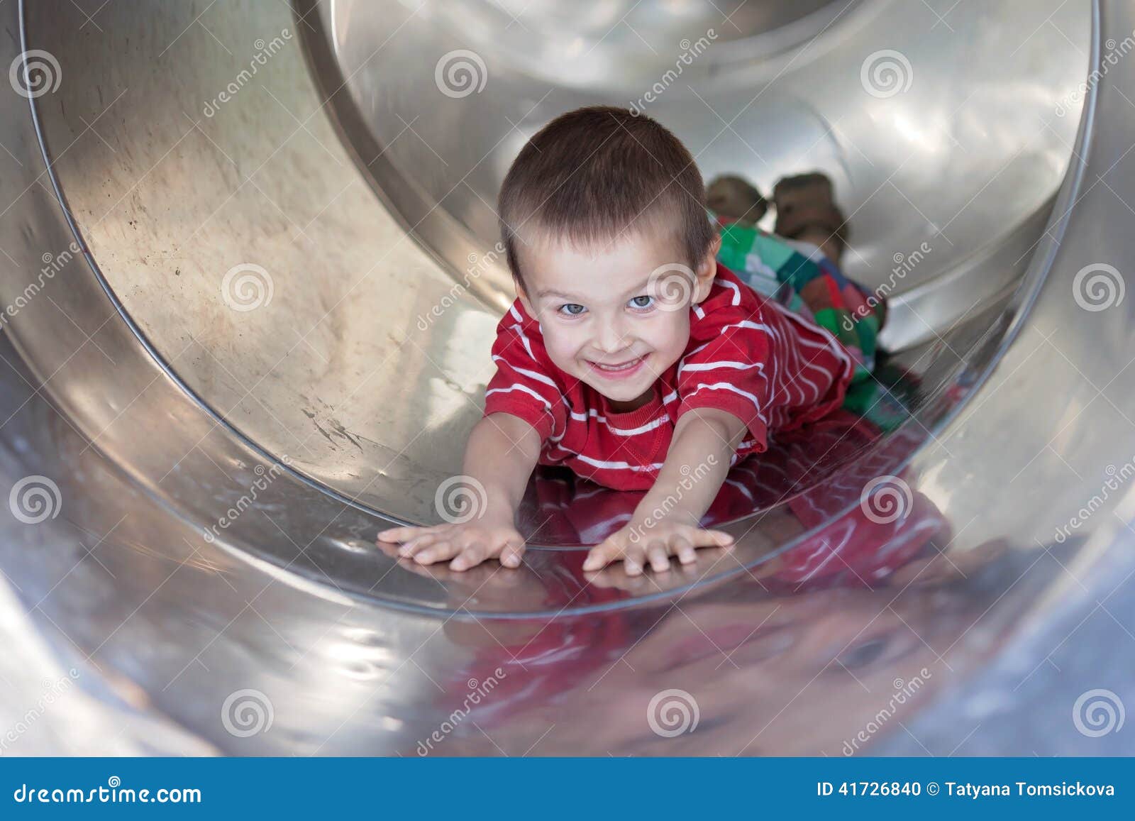 Cute Boy, Sliding Down the Slide, Smiling Stock Photo - Image of ...