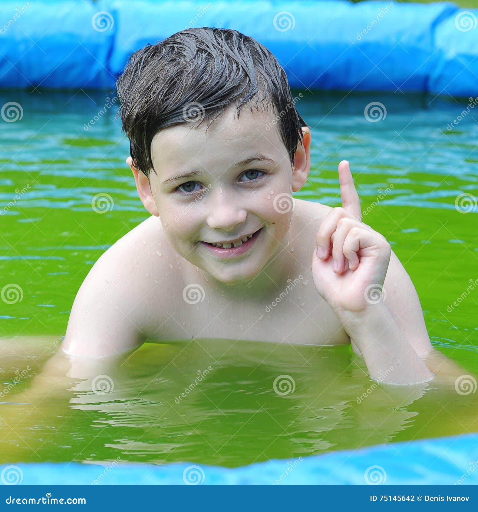 Cute Boy Smiling and Sitting in a Pool Stock Photo - Image of smiling ...