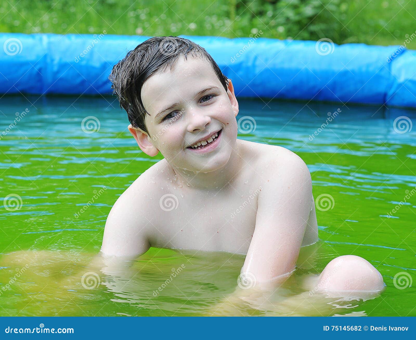 Cute Boy Smiling and Sitting in a Pool Stock Photo - Image of funny ...