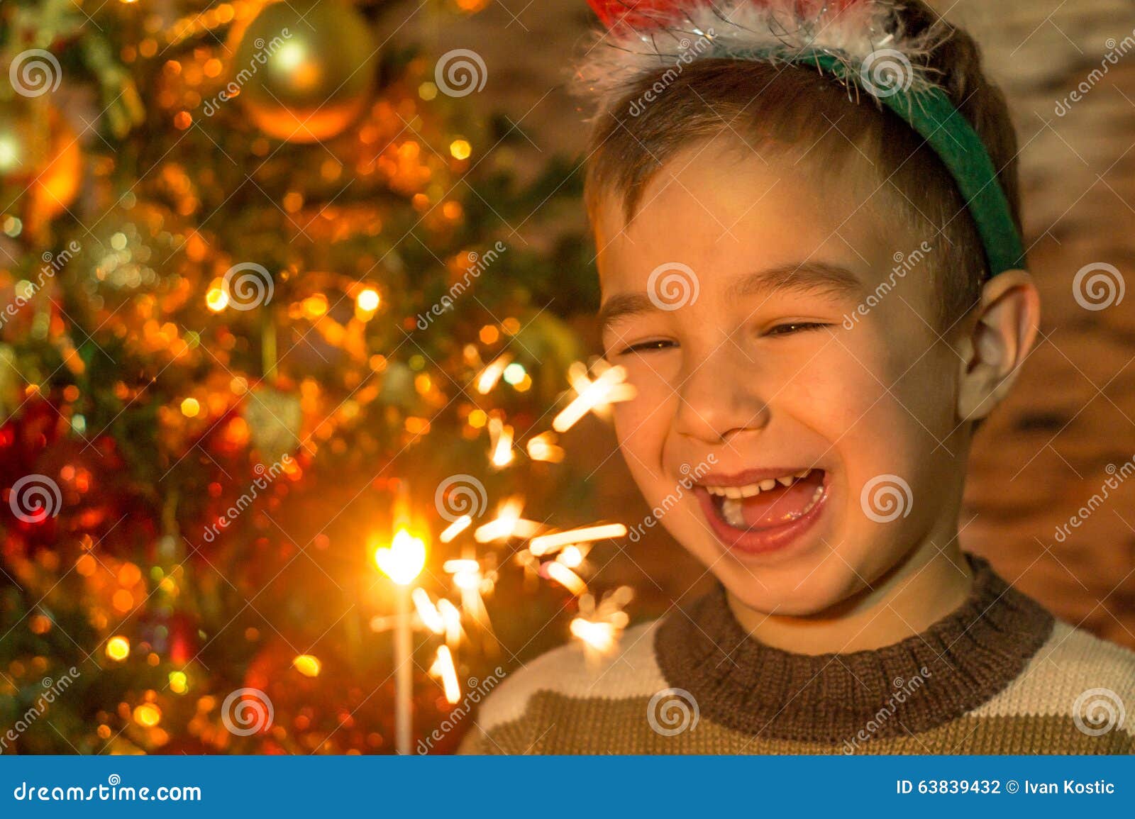 Cute boy with sparklers stock photo. Image of bright - 63839432