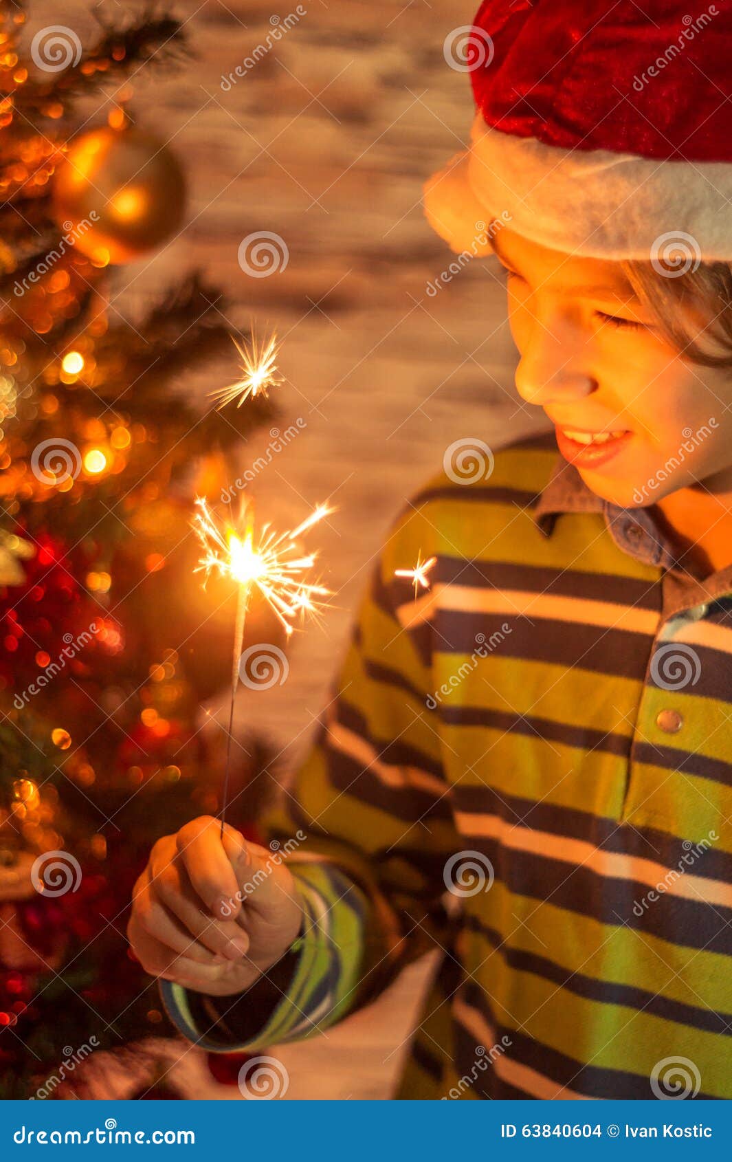 Cute boy with sparklers stock photo. Image of gift, celebration - 63840604