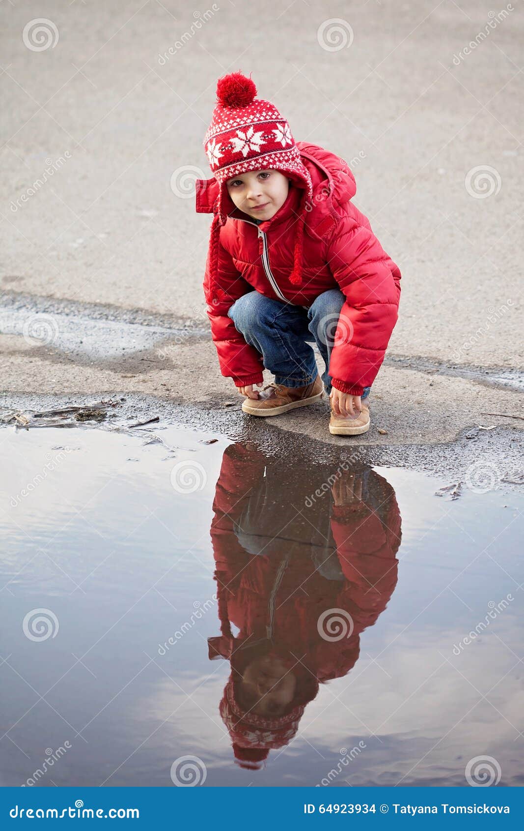 Cute Boy, Standing in Front of Big Puddle on the Street, Reflect Stock ...