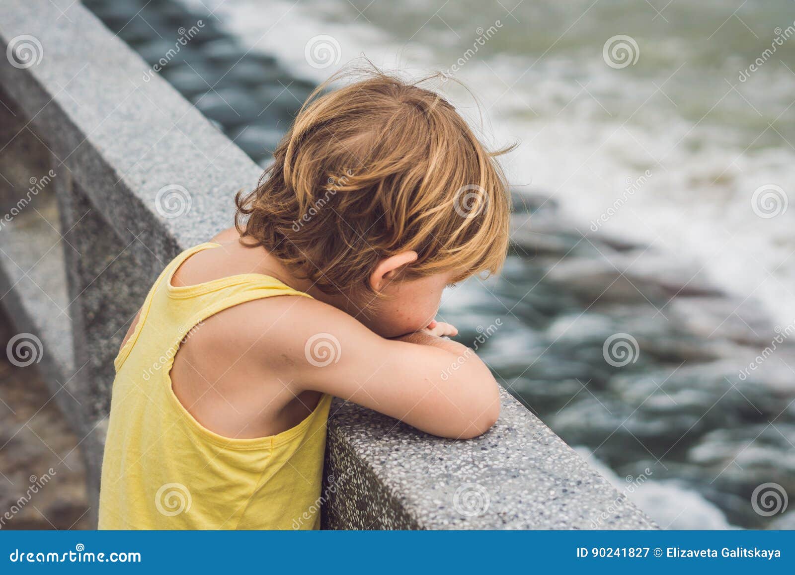 Cute Boy Stands on the Shore Watching the Ocean Waves Stock Image ...