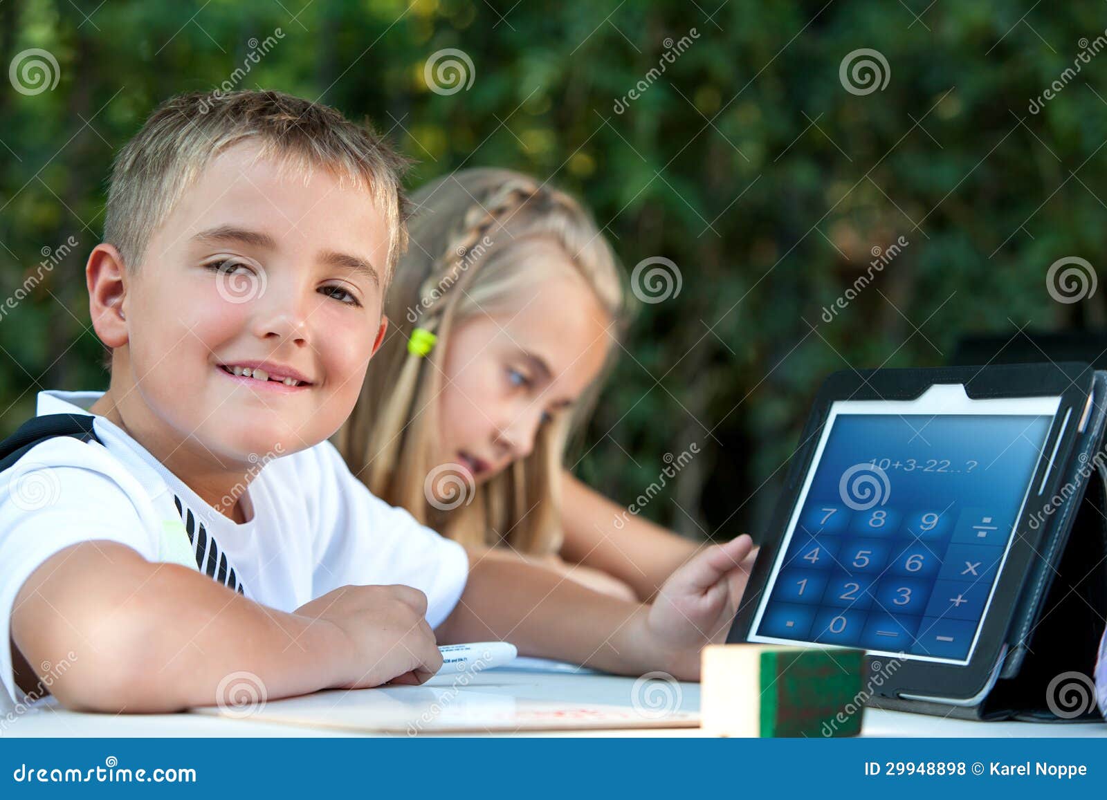 Boy Showing Homework on Tablet Outdoors. Stock Photo - Image of ...