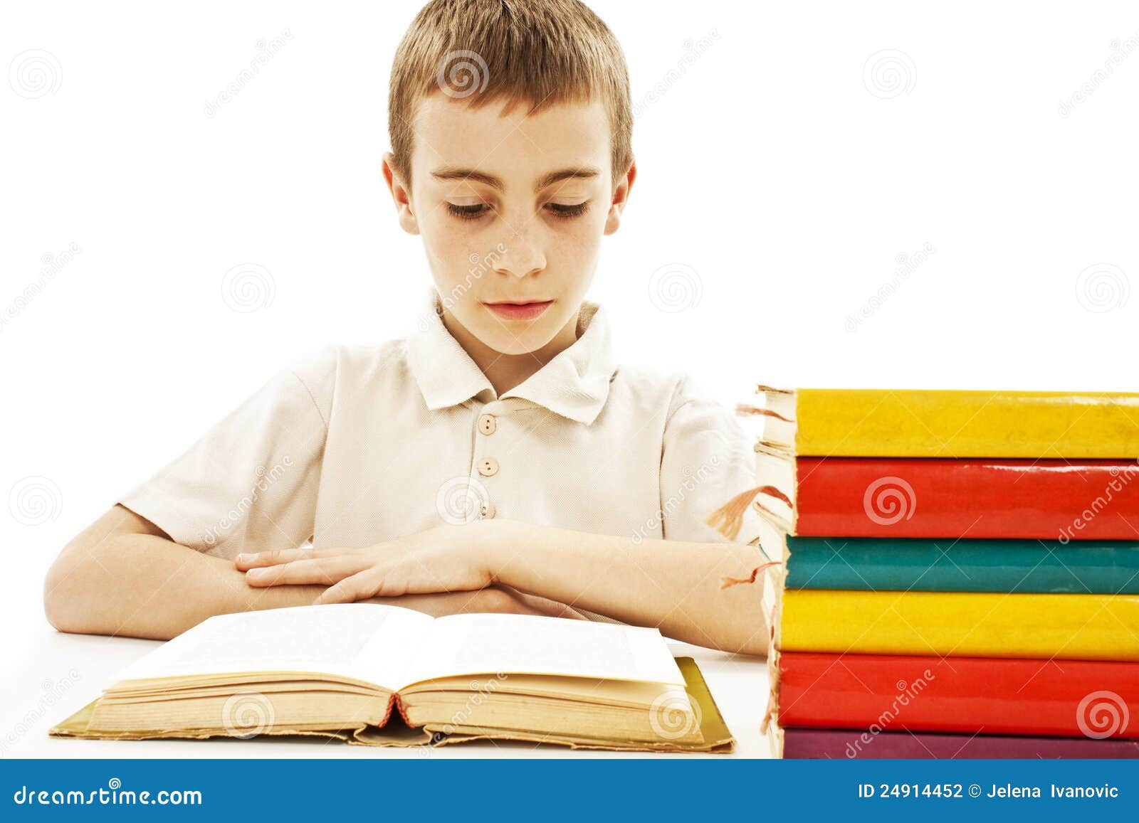 Cute Boy Studying and Reading a Book on His Desk Stock Photo - Image of ...