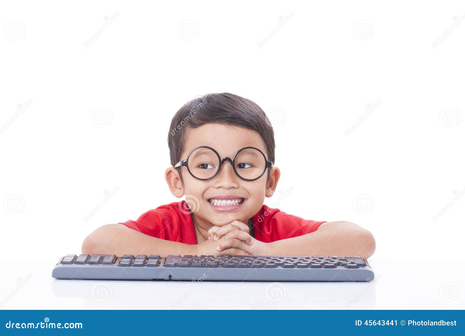 Cute Boy using a keyboard stock image. Image of passion - 45643441