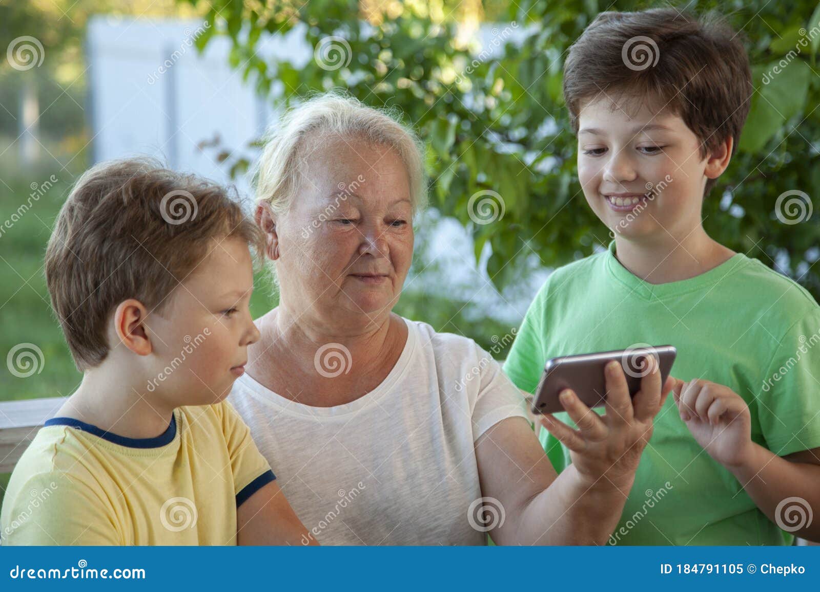 Cute Boy Using Smartphone with Grandma at Home Veranda Stock Image ...