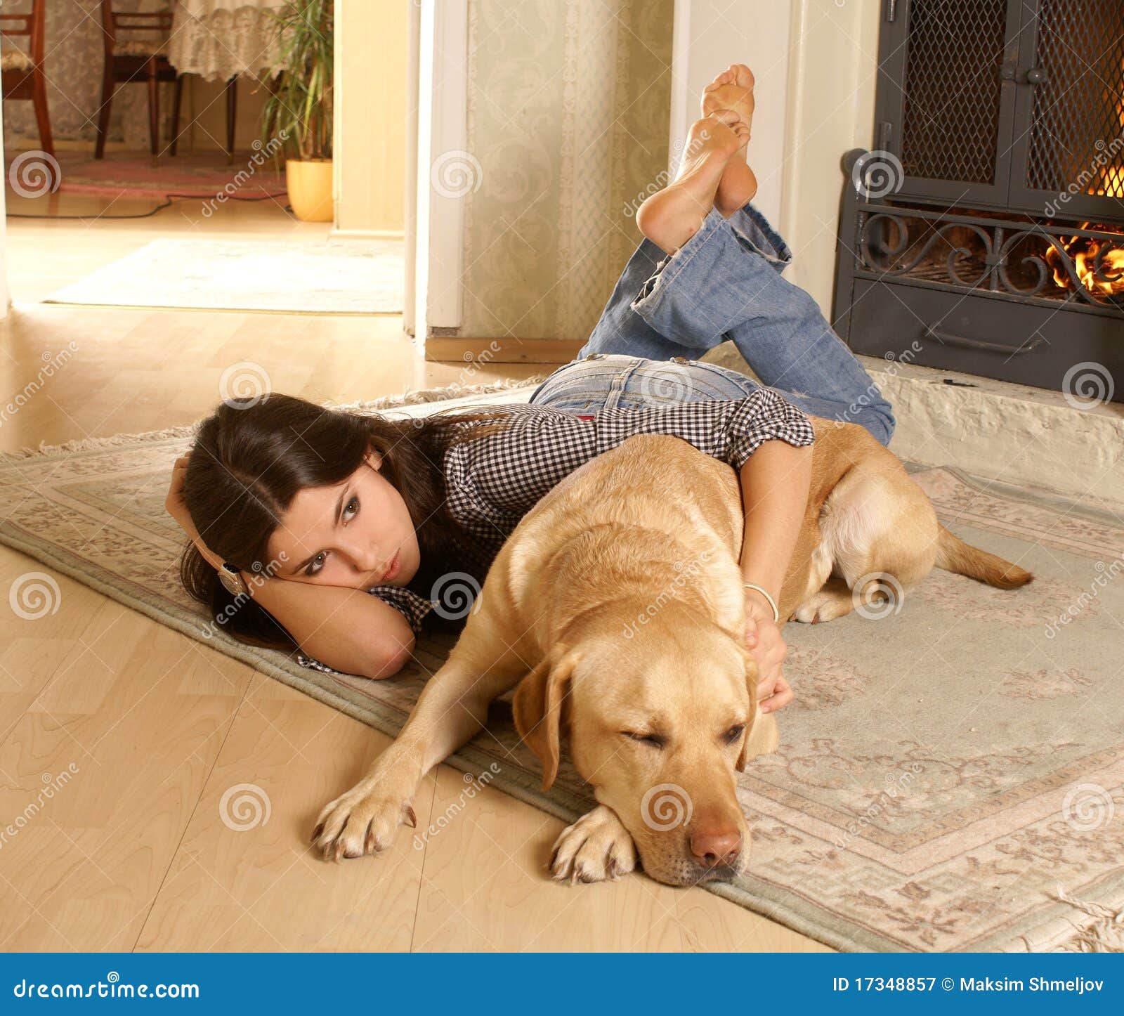 A Cute Brunette with a Dog on a Comfortable Carpet Stock Image - Image ...