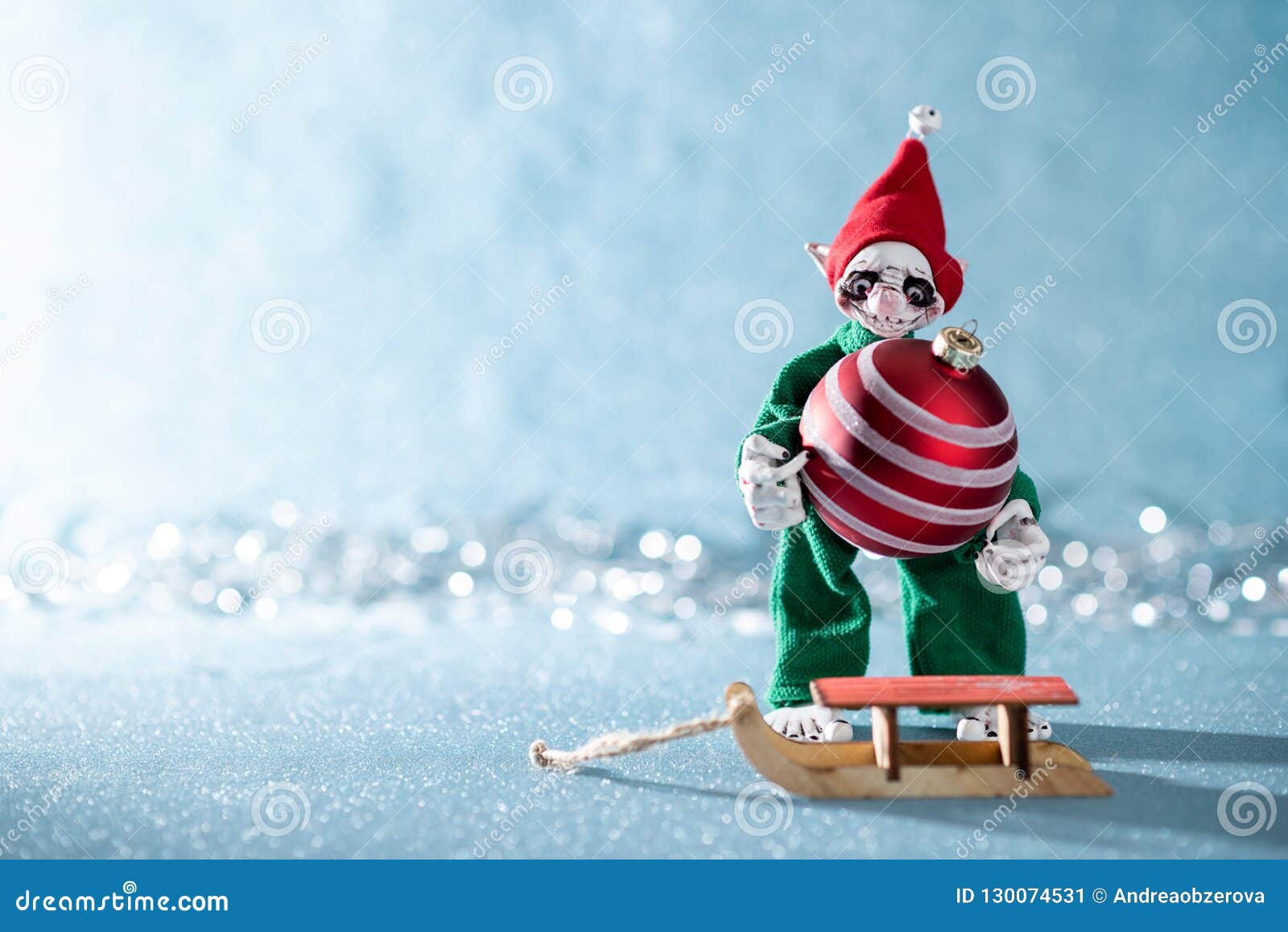Sad Santas Helper Elf Sitting On Sledge Looking At Broken Christmas ...