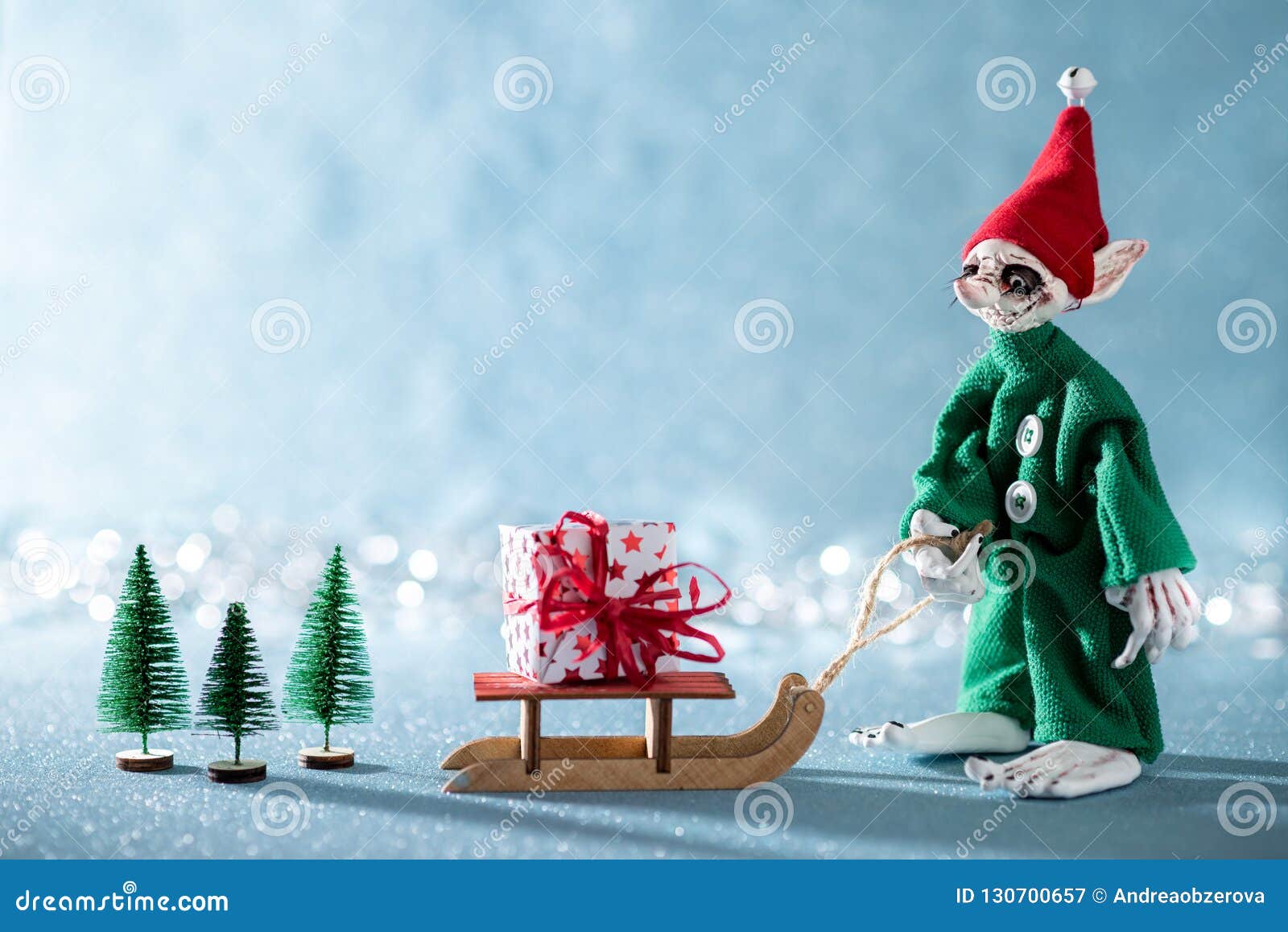 Sad Santas Helper Elf Sitting On Sledge Looking At Broken Christmas ...