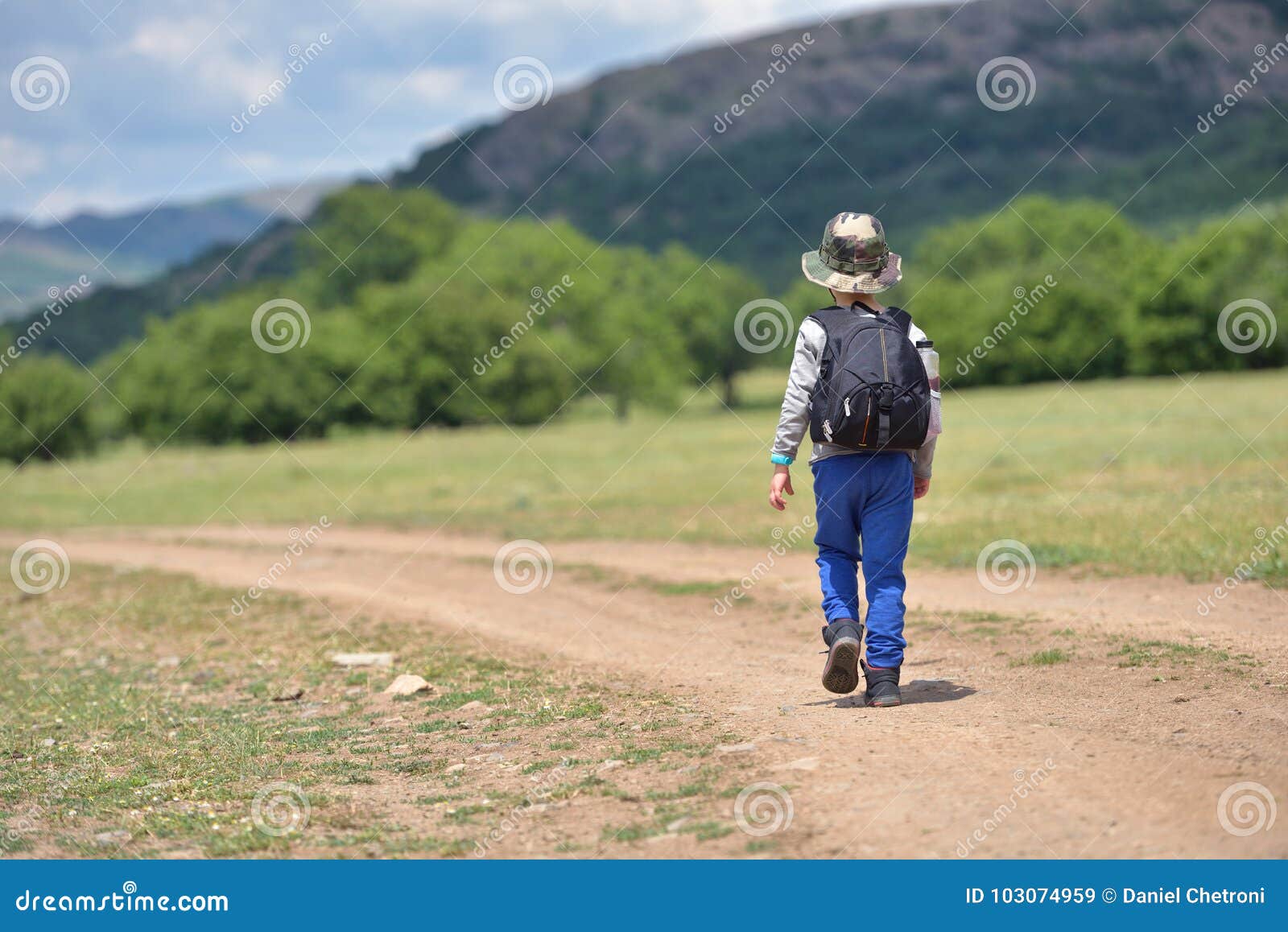 Cute Child Boy with Backpack Walking on a Little Path in Mountains ...